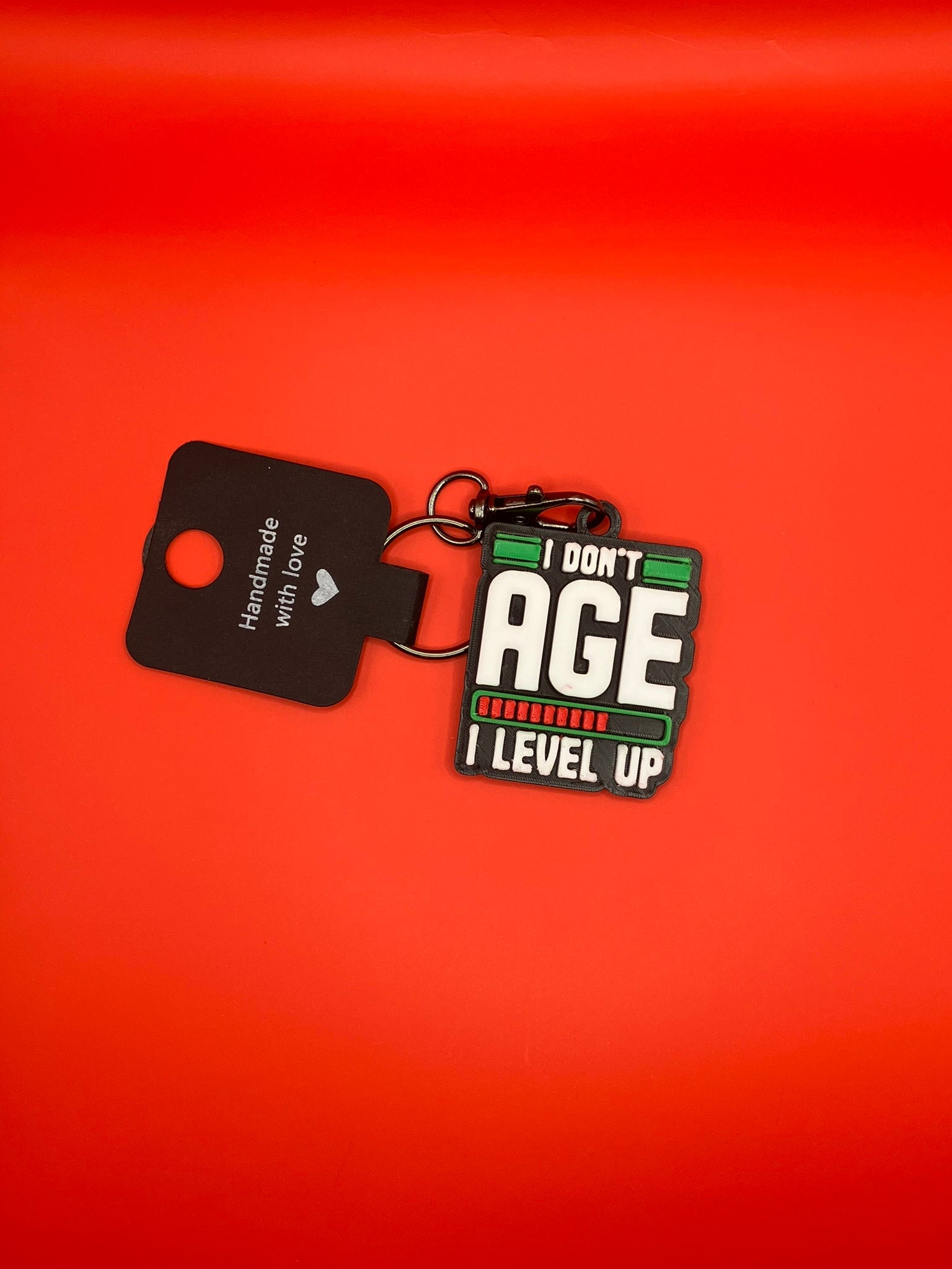 Keyring - "I don't age I level up" – StickEtch